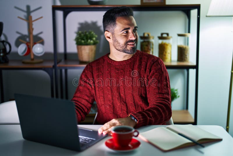Young Hispanic Man with Beard Using Computer Laptop at Night at Home ...