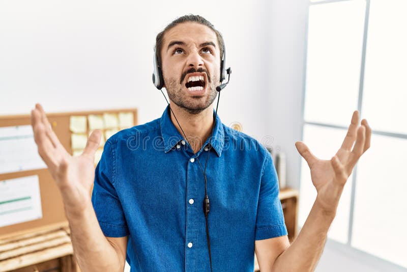 Young Hispanic Man with Beard Wearing Call Center Agent Headset at the ...