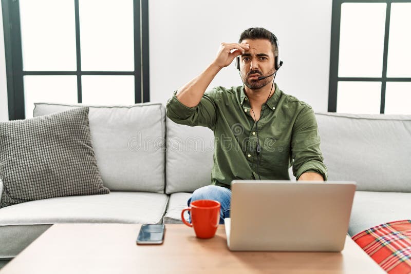 Young Hispanic Man with Beard Wearing Call Center Agent Headset Working ...