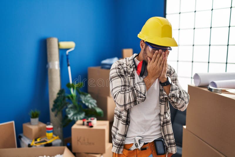 Young Hispanic Man with Beard Working at Home Renovation with Sad ...