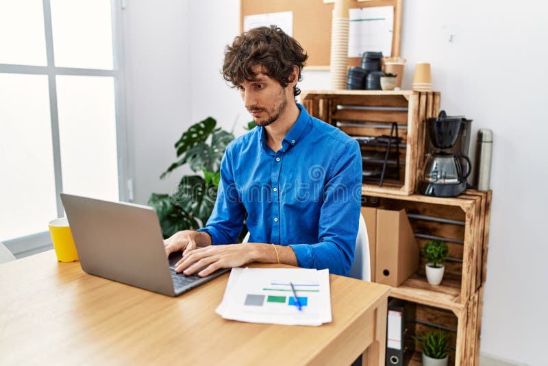 Young Hispanic Man with Beard Working at the Office Using Computer ...