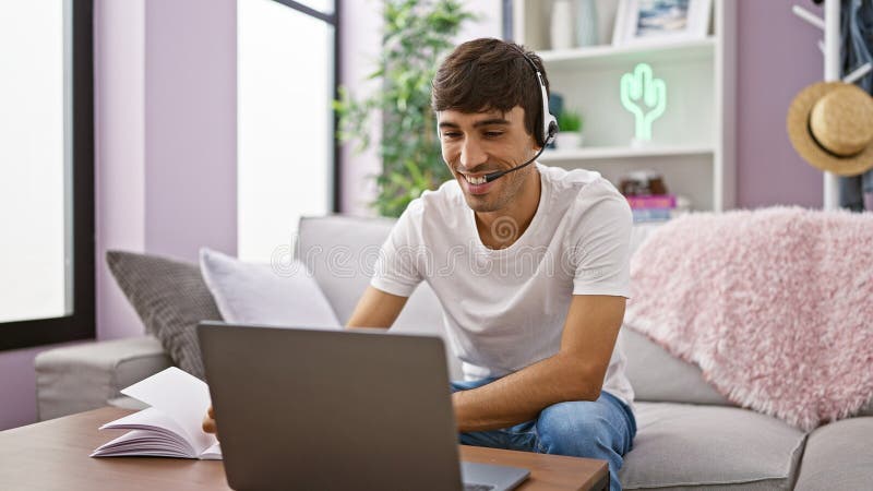 Young Hispanic Man Call Center Agent Having Video Call Taking Notes at ...