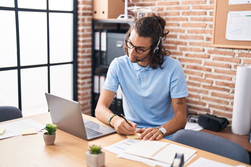 Young Hispanic Man Call Center Agent Writing on Reminder Paper at ...