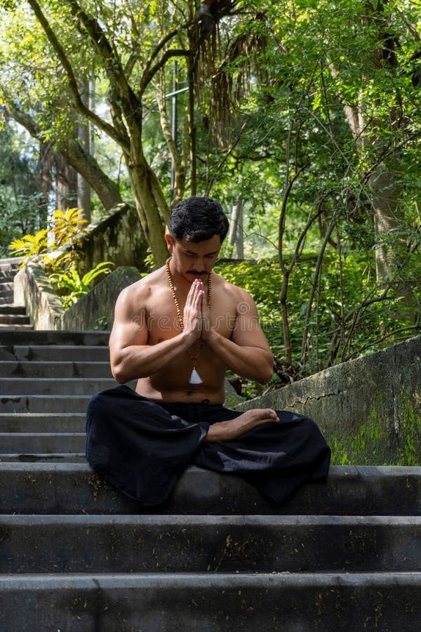 Young Hispanic Man Doing Meditation on a Stairway in a Forest, Mexico ... Young Hispanic Man Doing Meditation on a Stairway in a Forest, Mexico ...