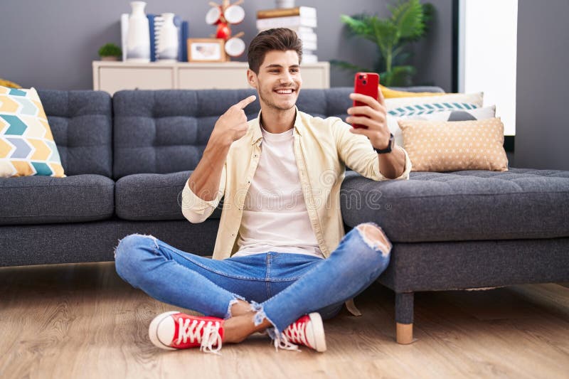 Young Hispanic Man Doing Video Call with Smartphone Smiling Happy ...