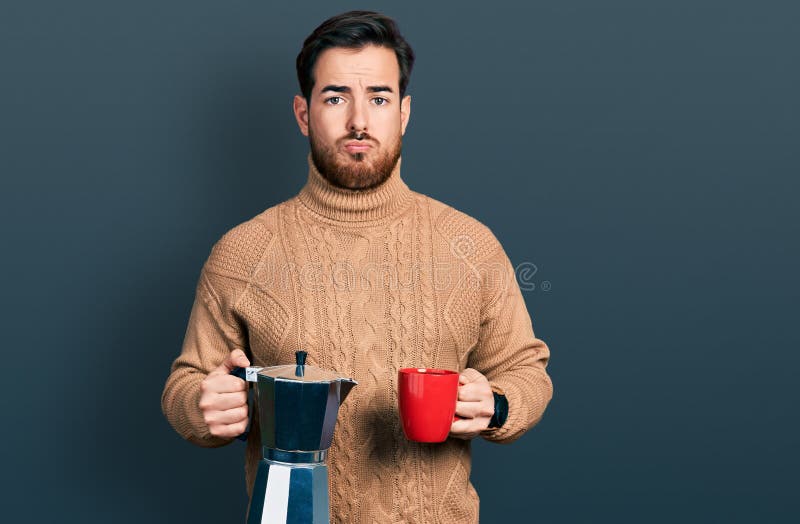 Young Hispanic Man Drinking Italian Coffee Depressed and Worry for ...