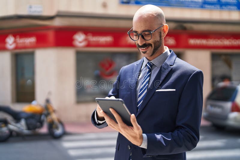 Young Hispanic Man Executive Smiling Confident Using Touchpad at Street ...