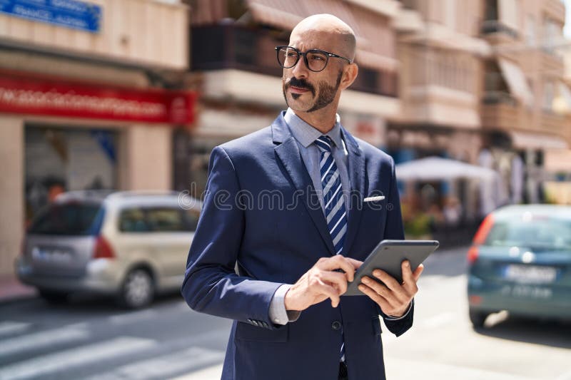Young Hispanic Man Executive Smiling Confident Using Touchpad at Street ...