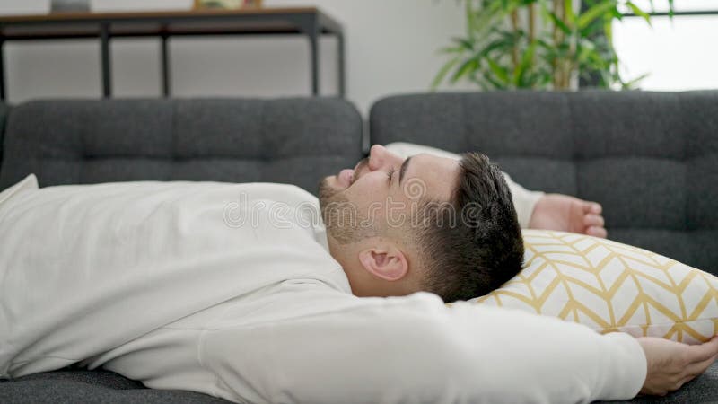 Young Hispanic Man Falling on Sofa Sleeping at Home Stock Video - Video ...