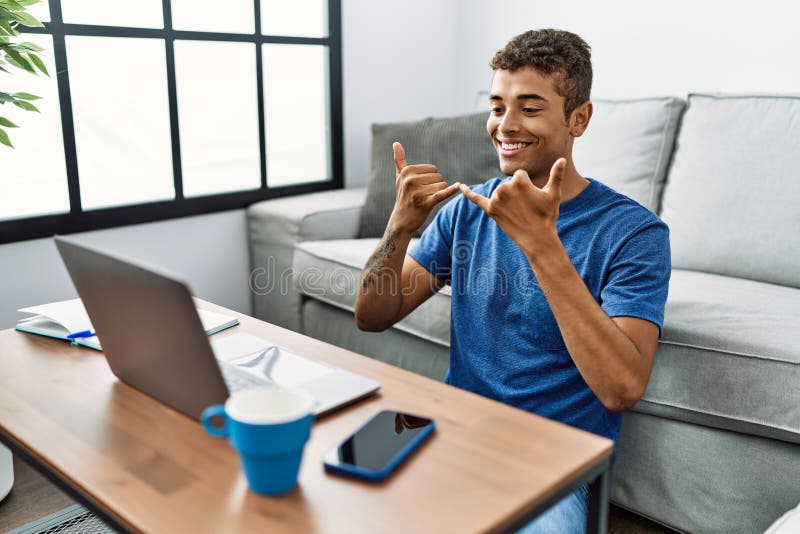 Young Hispanic Man Gesturing Sign Language on Video Call at Home Stock ...