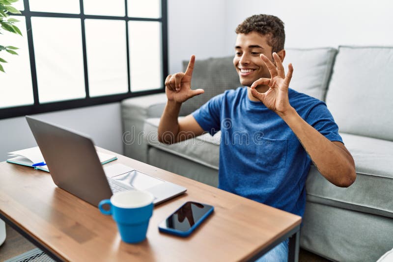 Young Hispanic Man Gesturing Sign Language on Video Call at Home Stock ...