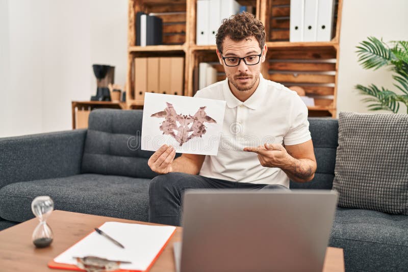 Young Hispanic Man Having Online Rorschach Test at Psychology Center ...