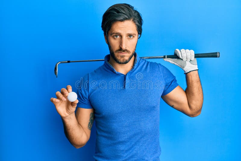 Young Hispanic Man Holding Golf Ball Depressed and Worry for Distress ...