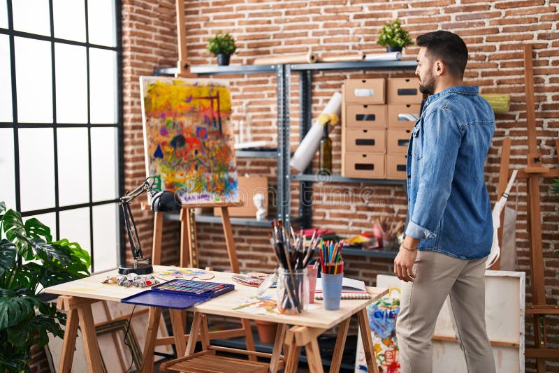 Young Hispanic Man Looking Draw Standing at Art Studio Stock Photo ...