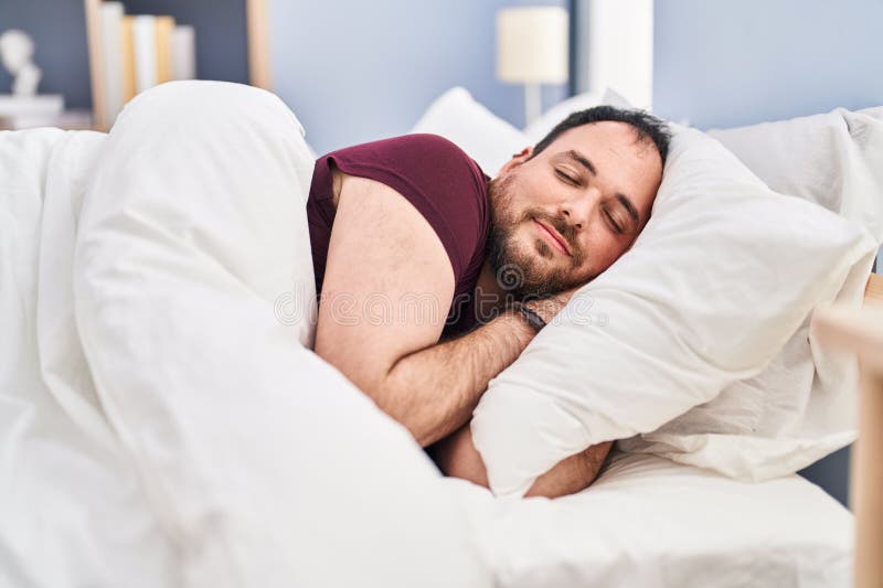 Young Hispanic Man Lying on Bed Sleeping at Bedroom Stock Image - Image ...