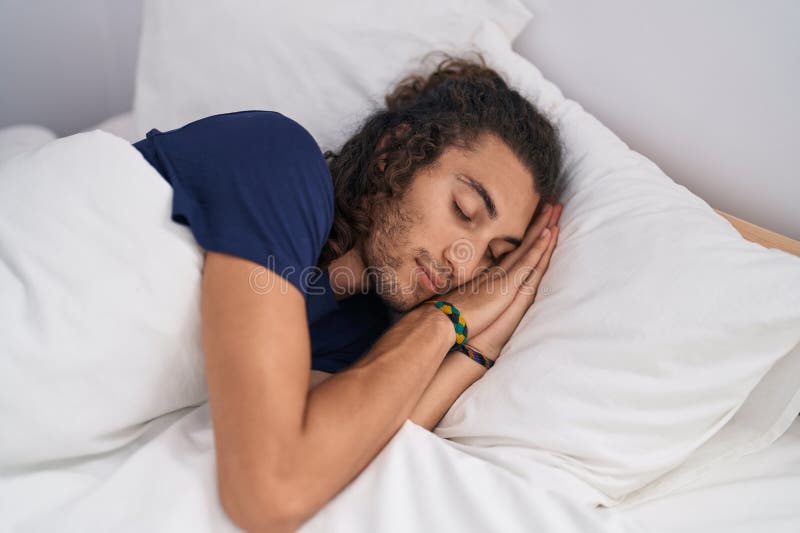 Young Hispanic Man Lying on Bed Sleeping at Bedroom Stock Image - Image ...