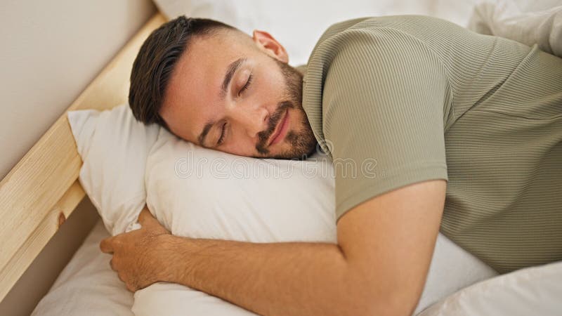 Young Hispanic Man Lying on Bed Sleeping at Bedroom Stock Photo - Image ...