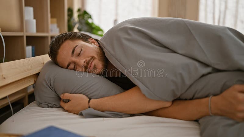 Young Hispanic Man Lying on Bed Sleeping at Bedroom Stock Image - Image ...