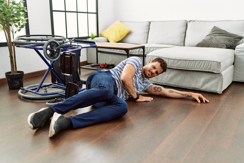 Young Hispanic Man Lying on Floor for Accident at Home Stock Image ...