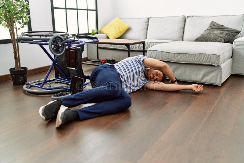Young Hispanic Man Lying on Floor for Accident at Home Stock Image ...