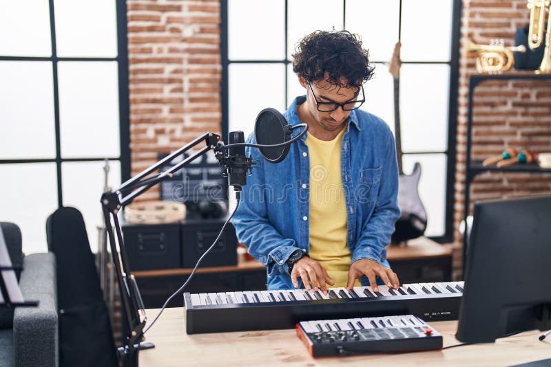 Young Hispanic Man Musician Playing Piano Keyboard at Music Studio ...