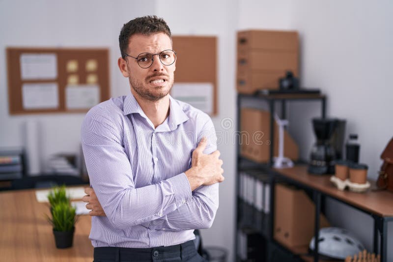 Young Hispanic Man at the Office Shaking and Freezing for Winter Cold ...