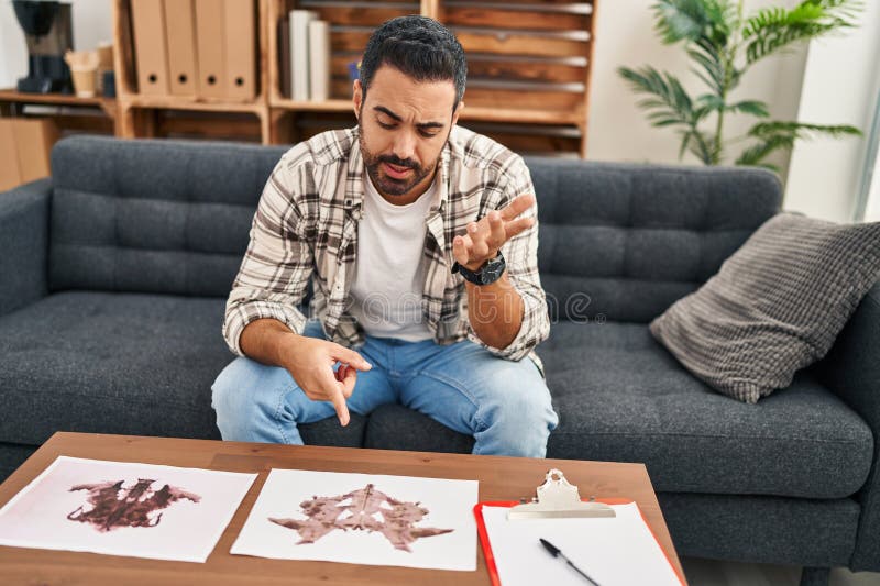 Young Hispanic Man Patient Having Rorschach Test at Psychology Center ...