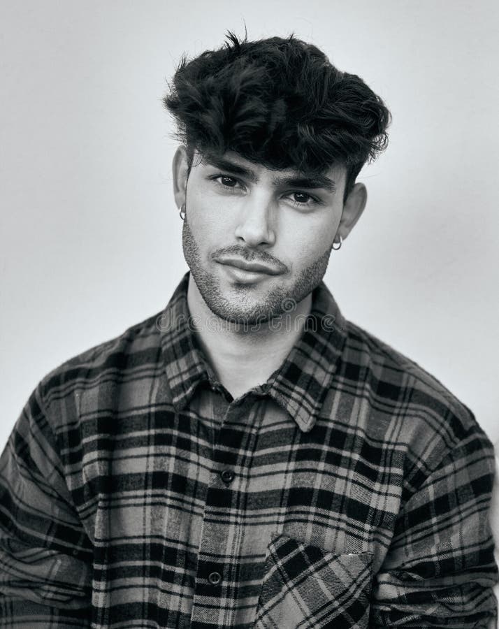 Young Hispanic Man Posing with Relaxed Expression Looking To the Camera ...