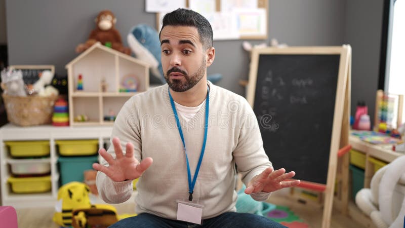Young Hispanic Man Preschool Teacher Asking for Silence at Kindergarten ...