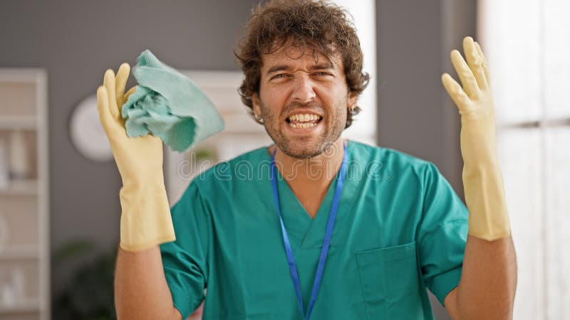 Young Hispanic Man Professional Cleaner Angry and Screaming at Home ...