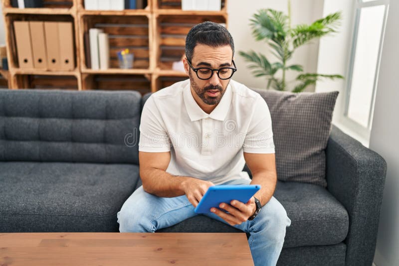 Young Hispanic Man Psychologist Having Therapy Session Using Touchpad ...