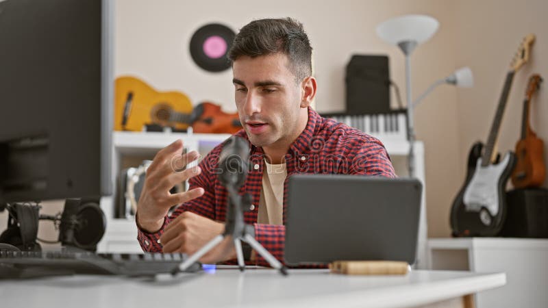 Young Hispanic Man Radio Reporter Using Microphone Speaking at Radio ...