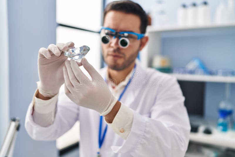 Young Hispanic Man Scientist Looking Diamond by Magnifying Glasses at ...