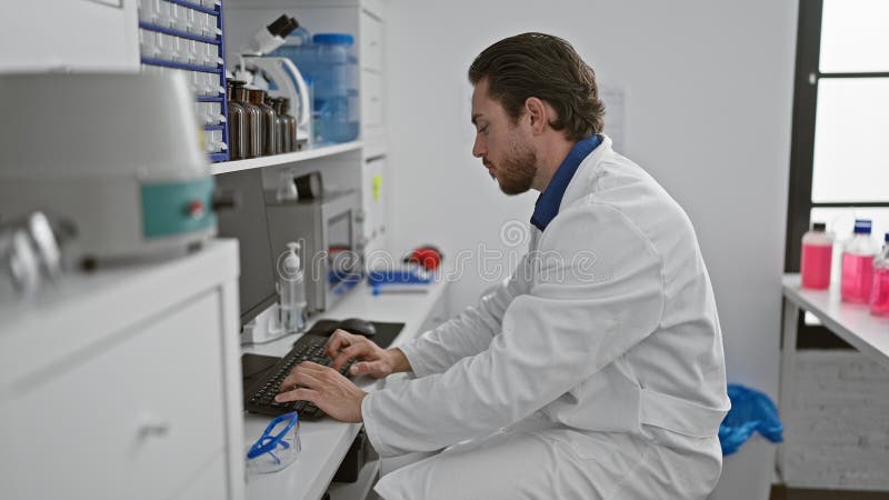 Young Hispanic Man Scientist Using Computer at Laboratory Stock Video ...