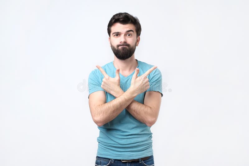 Young Hispanic Man Shows in Different Direction Stock Photo - Image of ...