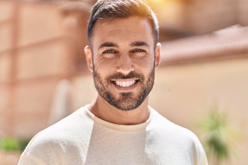 Young Hispanic Man Smiling Confident Standing at Street Stock Image ...