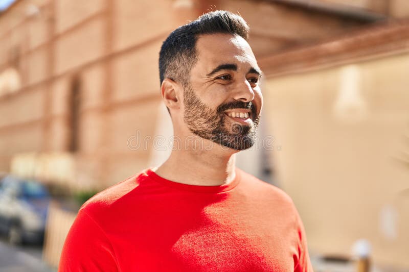 Young Hispanic Man Smiling Confident Standing at Street Stock Photo ...