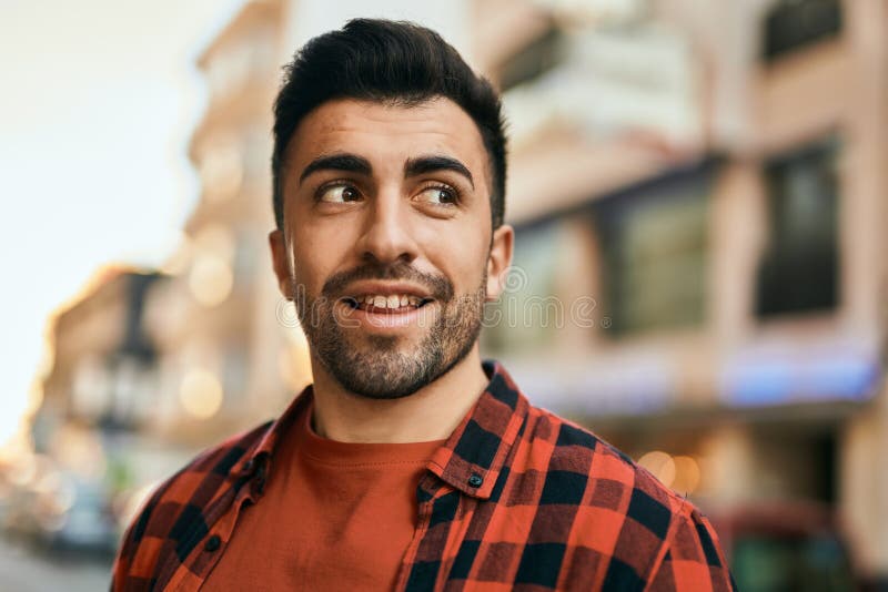Young Hispanic Man Smiling Happy Standing at the City Stock Image ...