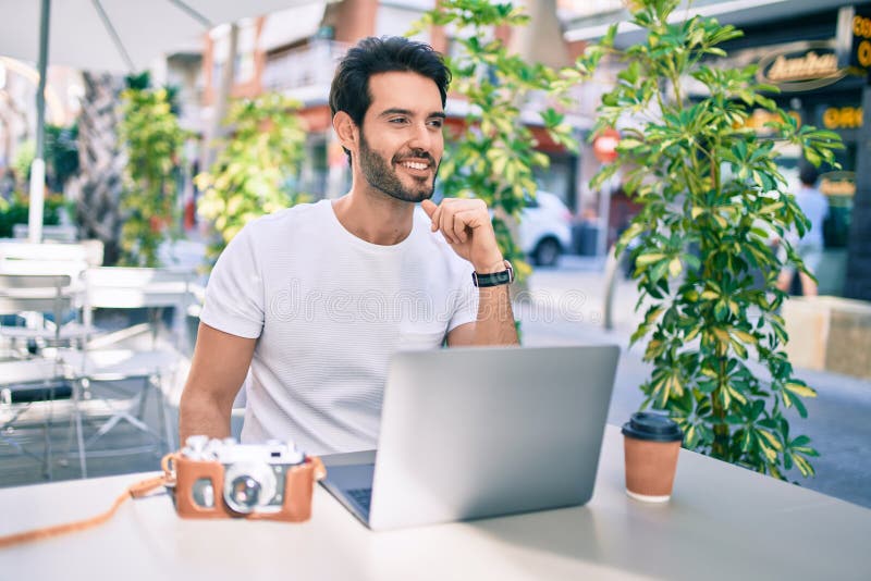 Young Hispanic Man Smiling Happy Working Using Laptop at Coffee Shop ...