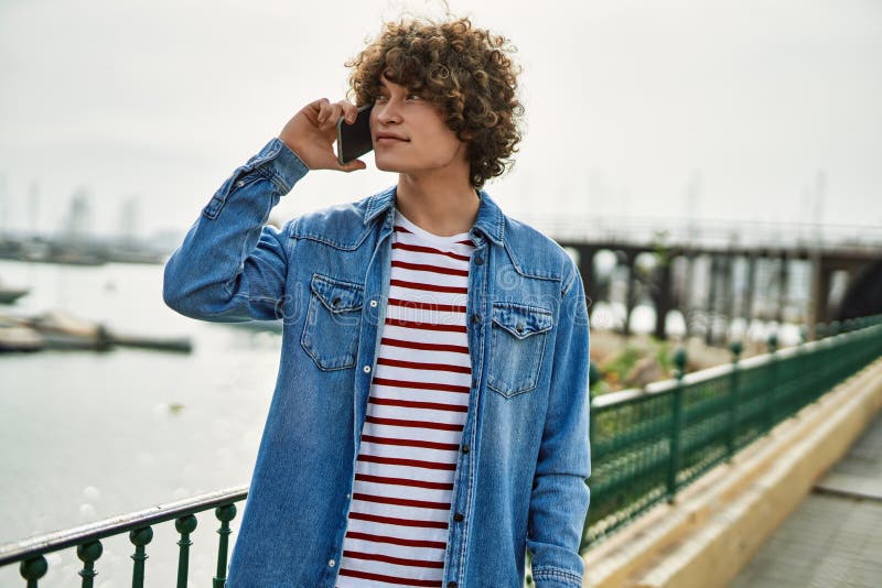 Young Hispanic Man Speaking on the Phone at Marina Port Stock Photo ...