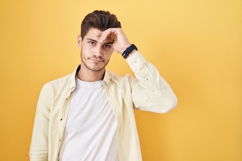 Young Hispanic Man Standing Over Yellow Background Worried and Stressed ...