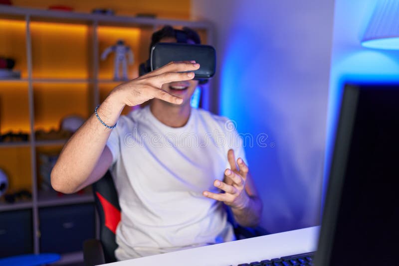 Young Hispanic Man Streamer Playing Video Game Using Virtual Reality ...