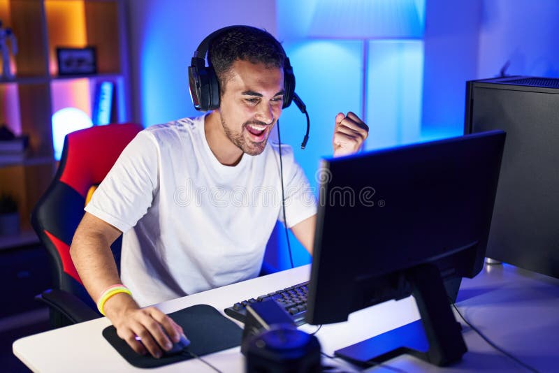 Young Hispanic Man Streamer Playing Video Game with Winner Expression ...