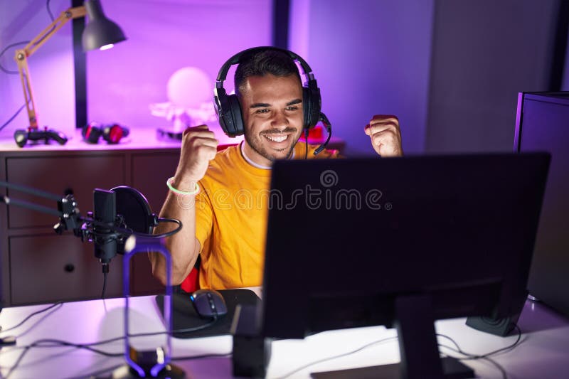Young Hispanic Man Streamer Playing Video Game with Winner Expression ...