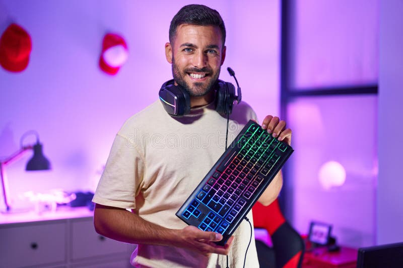 Young Hispanic Man Streamer Smiling Confident Holding Keyboard Computer ...