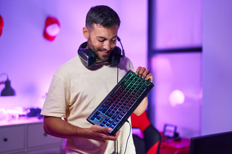 Young Hispanic Man Streamer Smiling Confident Holding Keyboard Computer ...