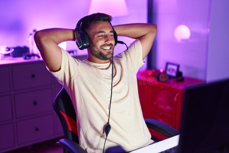 Young Hispanic Man Streamer Smiling Confident Relaxed with Hands on ...