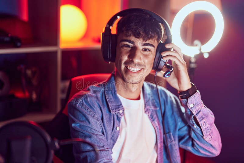 Young Hispanic Man Streamer Smiling Confident Sitting on Table at ...