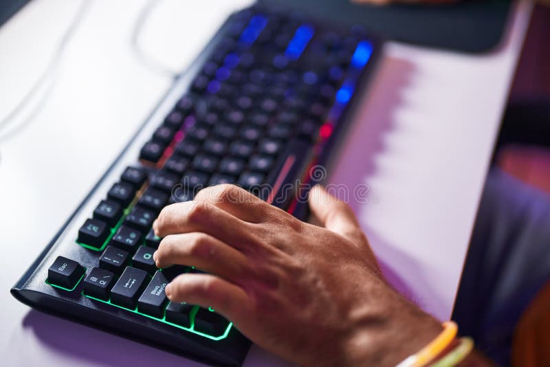 Young Hispanic Man Using Computer Keyboard at Gaming Room Stock Photo ...