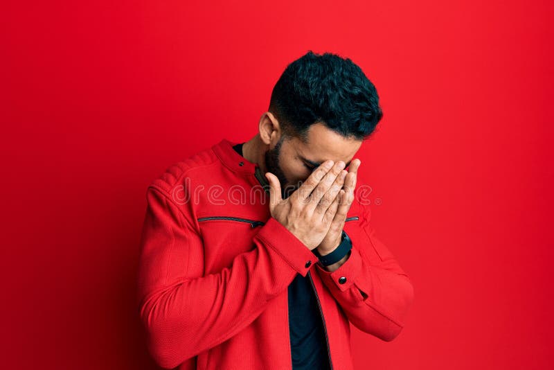 Young Hispanic Man Wearing Red Leather Jacket with Sad Expression ...